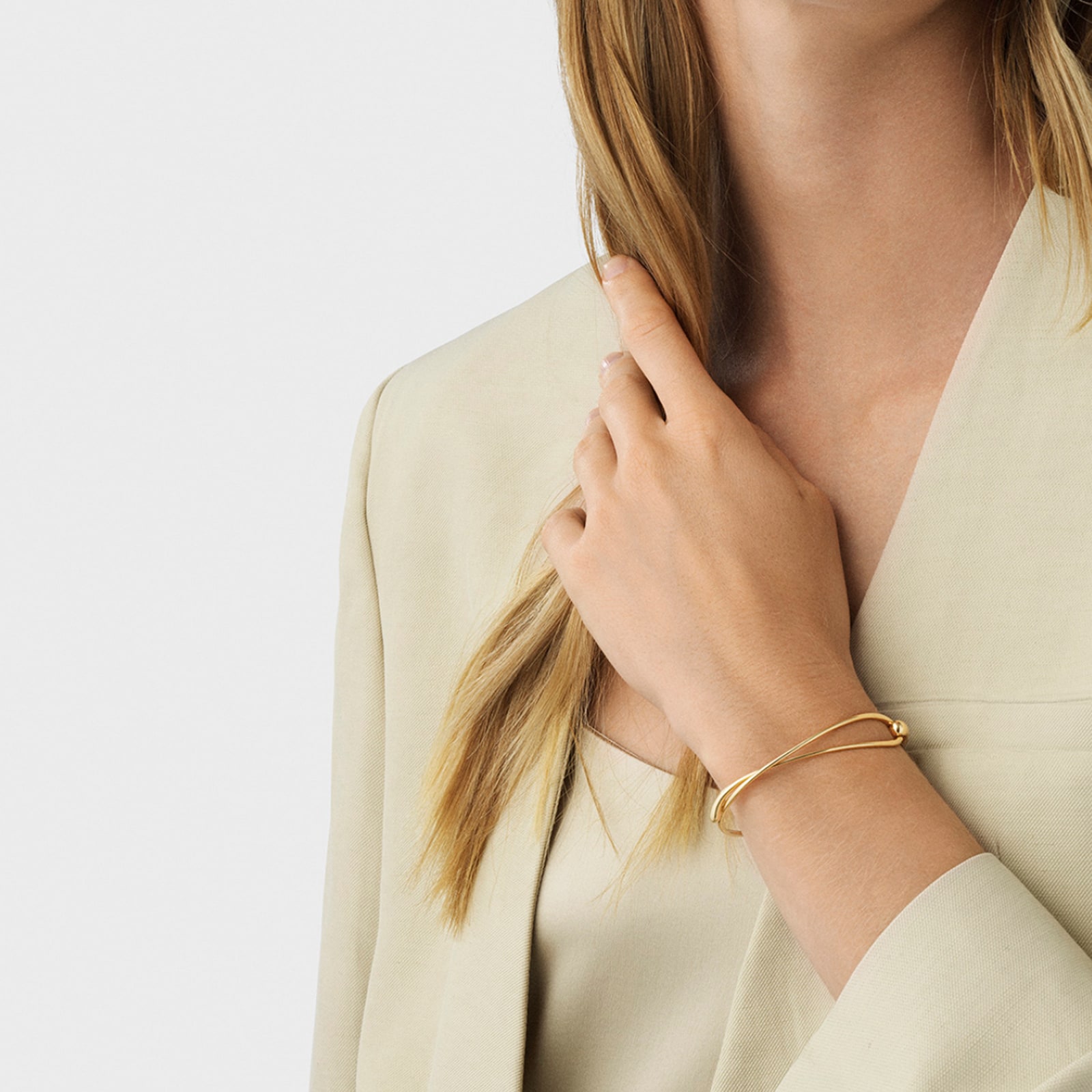 Georg Jensen 18ct Yellow Gold MERCY Swirl Bangle 20001086 | Goldsmiths